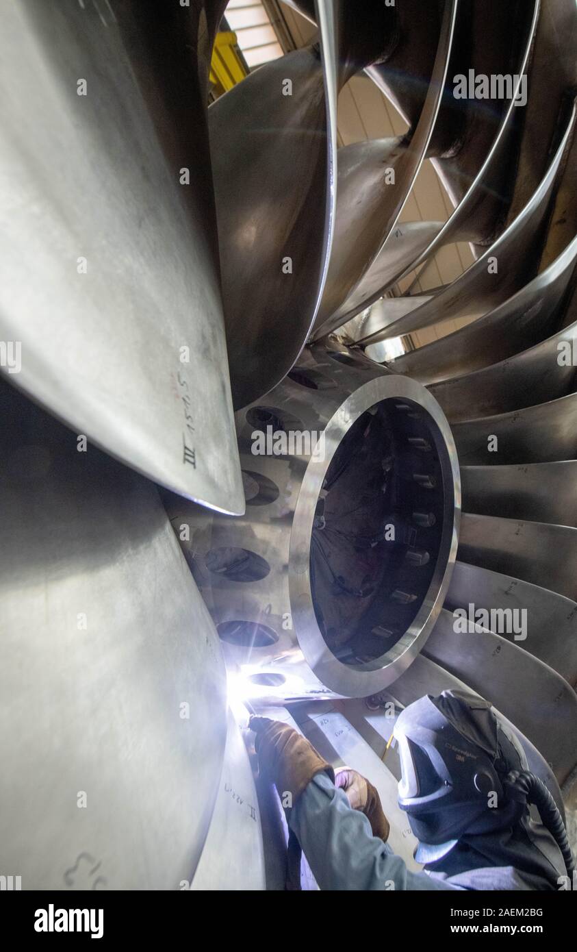Heidenheim, Germany. 09th Dec, 2019. A worker welds the blades of a ...