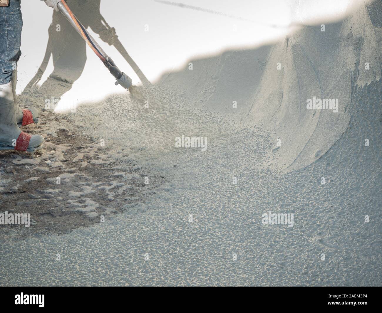 Man spraying cement during a swimming pool renovation Stock Photo - Alamy