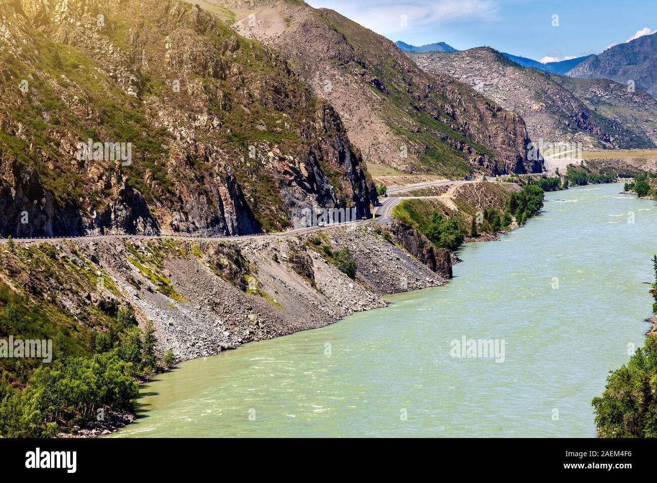 The turquoise river of the Katun in the mountains of the Altai among ...