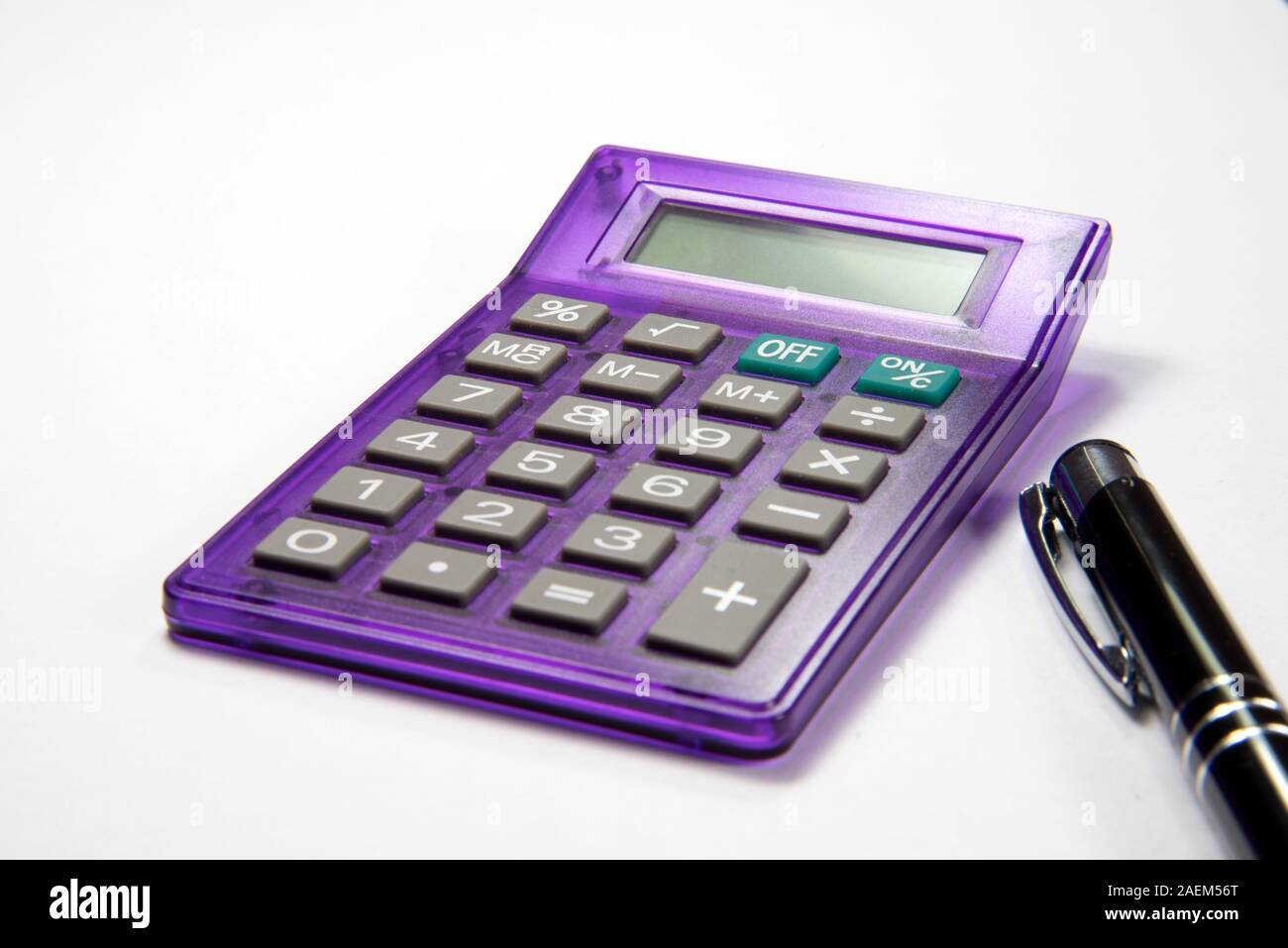 A calculator and a pen Stock Photo - Alamy