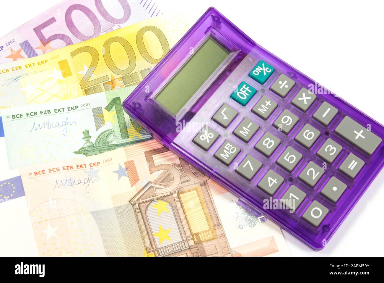 Euro bills and a calculator Stock Photo - Alamy