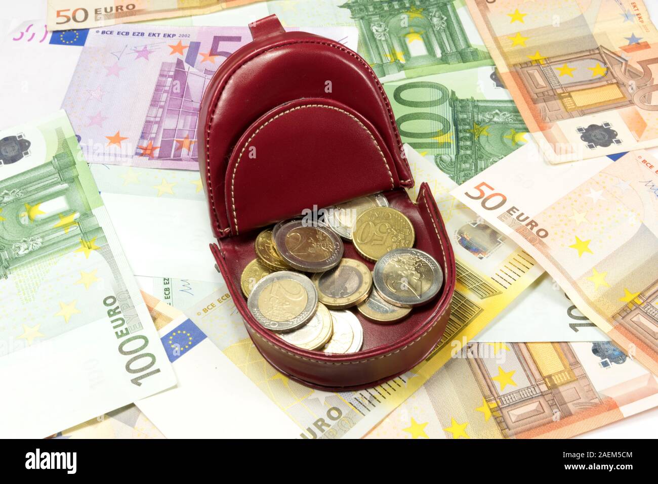 Euro bills and coins and a wallet Stock Photo - Alamy