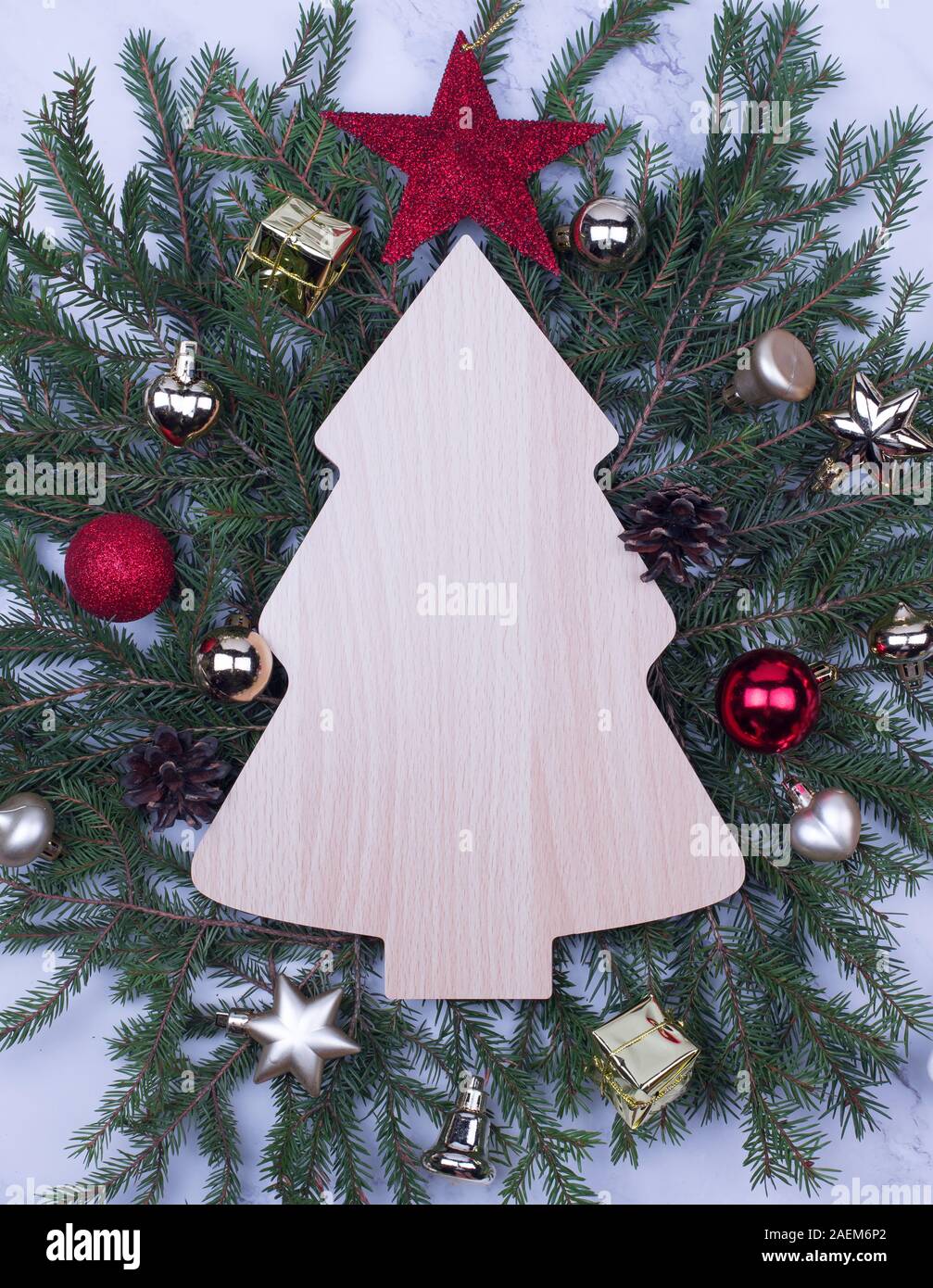 decorative frame in the shape of a Christmas tree with toys on the ...