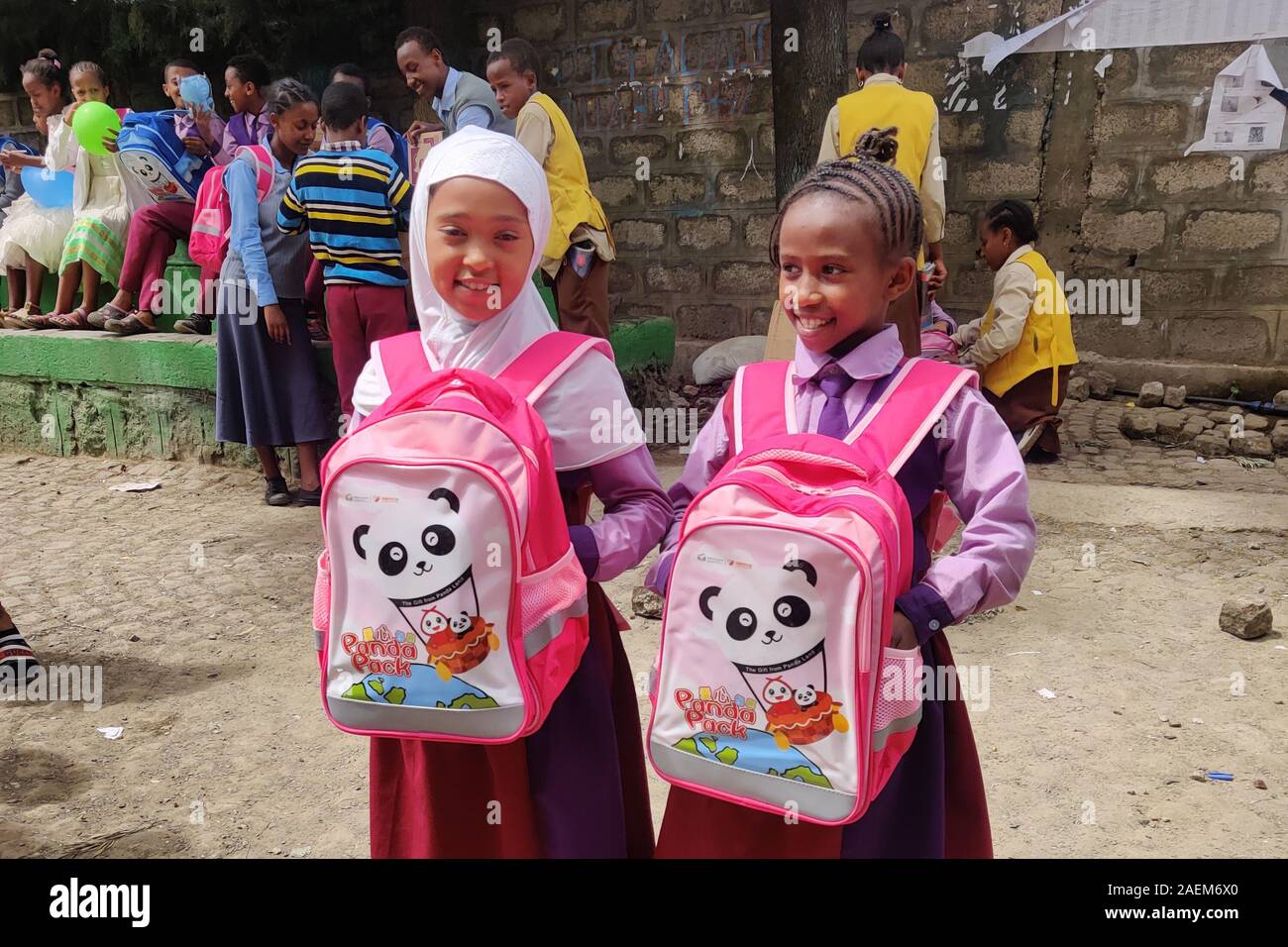 Students at a local primary school receives panda packs from Chinese ...