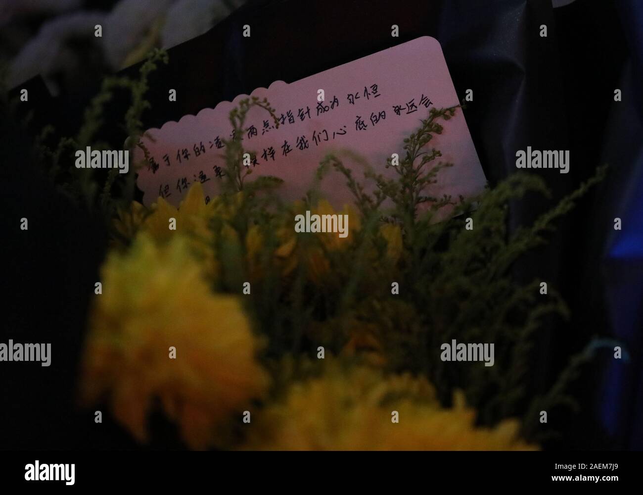 Fans lay individual wreathes and flowers at the recording scene in ...