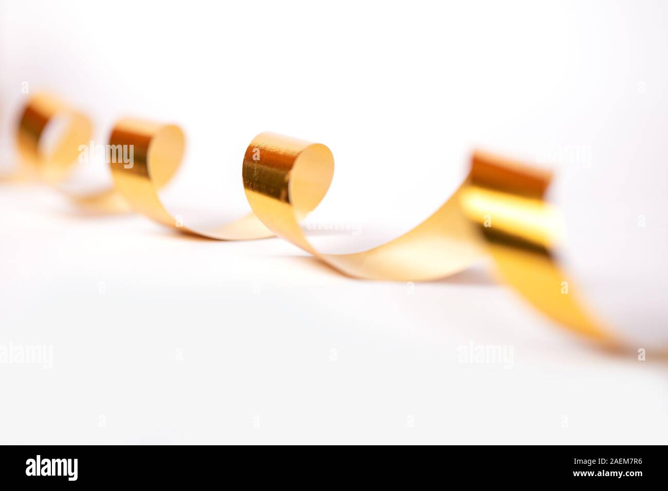 Hanging gold party ribbon confetti hi-res stock photography and images ...