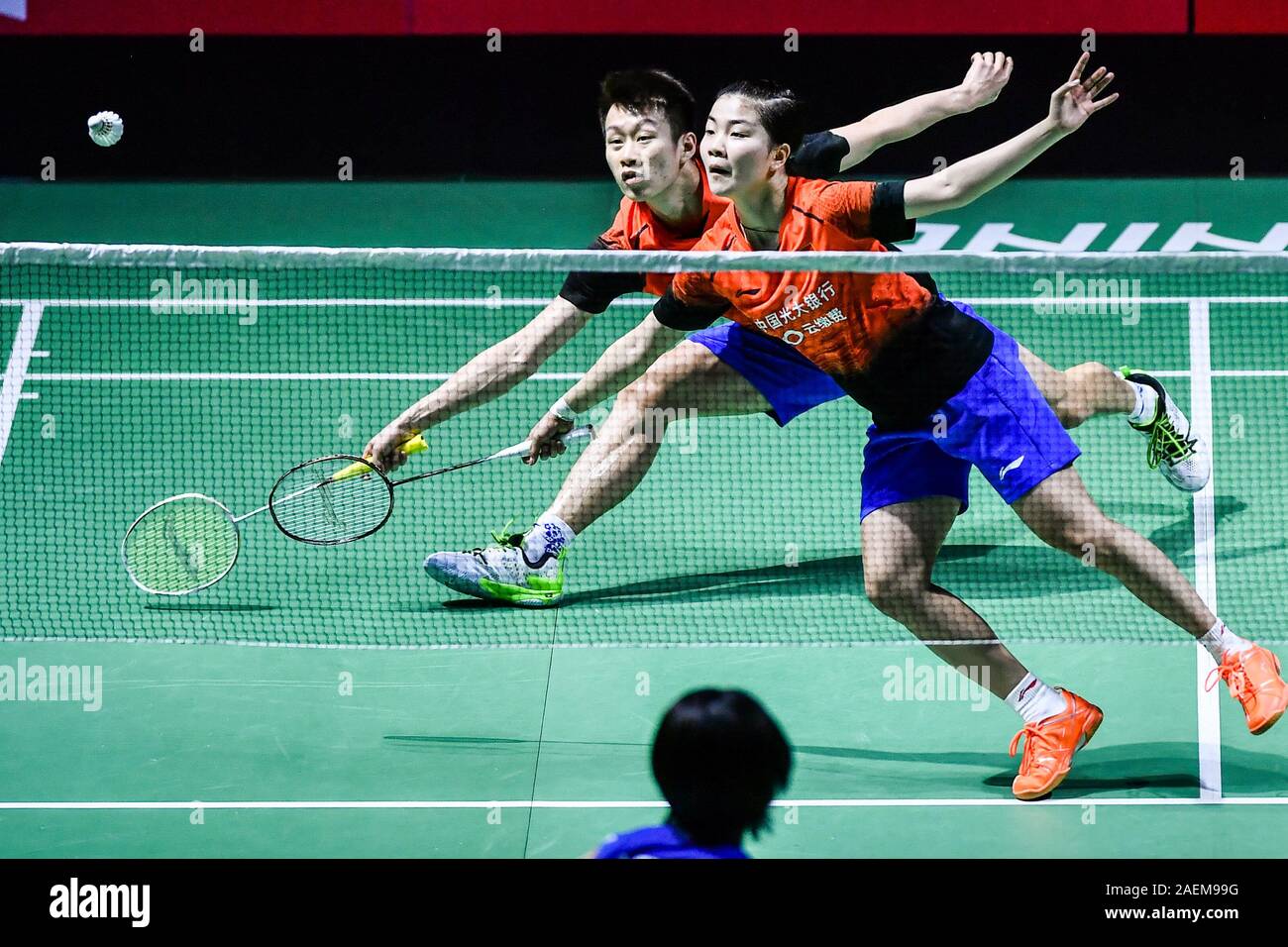 Ren Xiaoyu and Zhou Chaomin of China get the ball against Kouhei Gondou ...