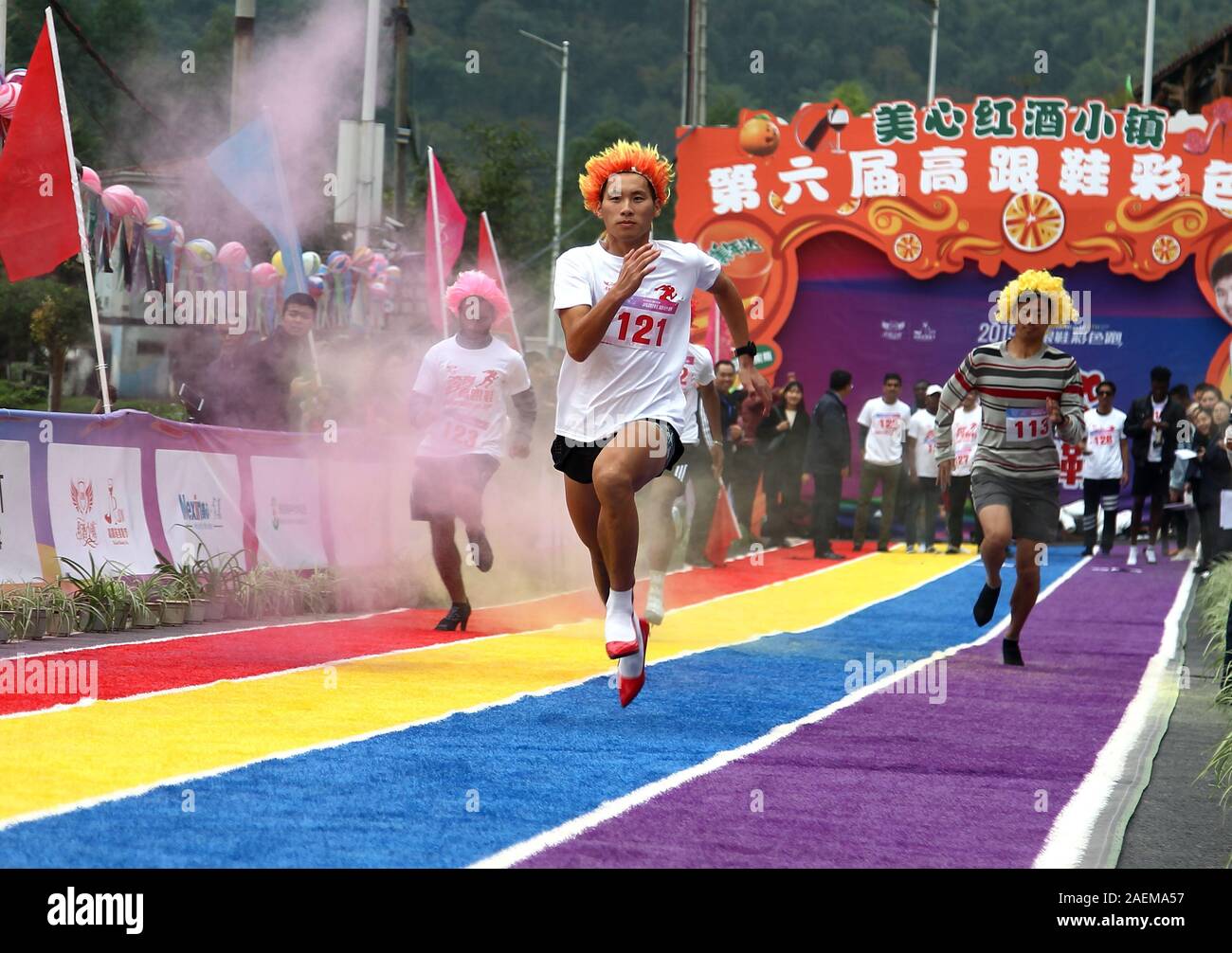People run with high-heel shoes at the 6th High-Heeled Shoes Color Run ...