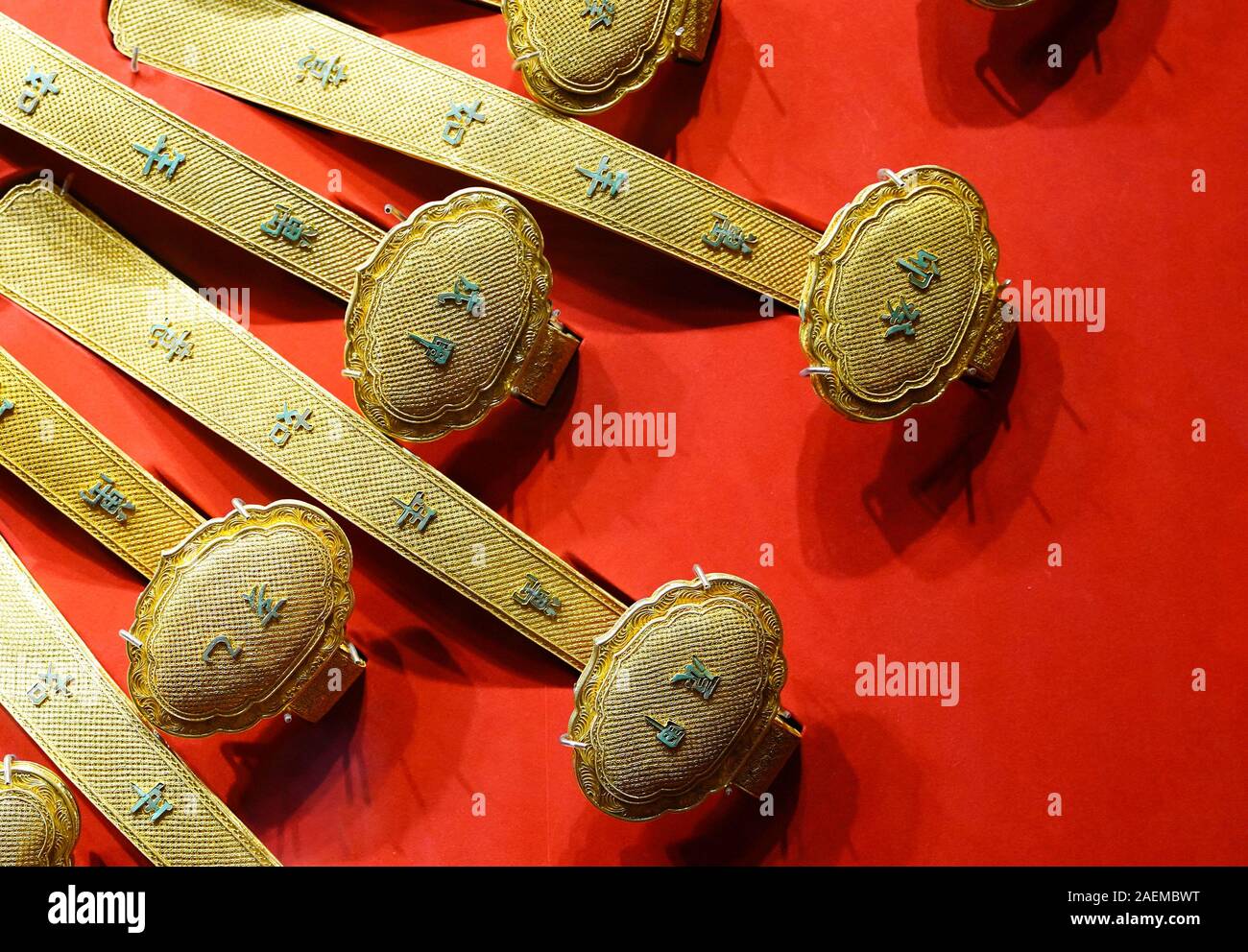 A gift for Qianlong Emperor's birthday, golden ruyi, is demonstrated at ...