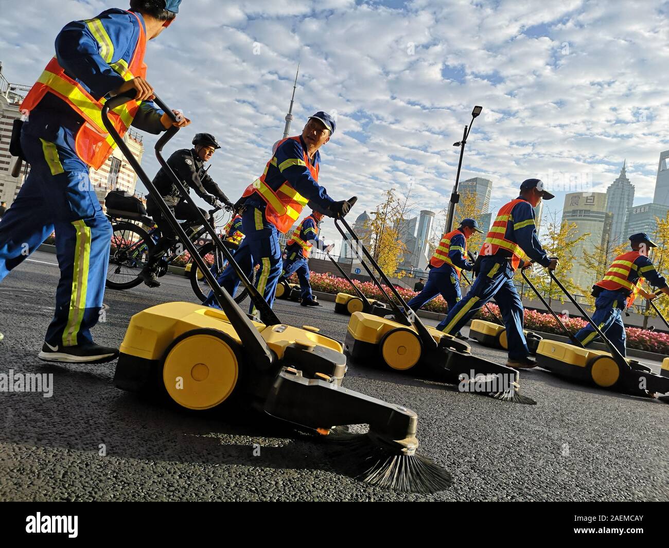 Sanitation worker run with cleaning machines after participants to ...