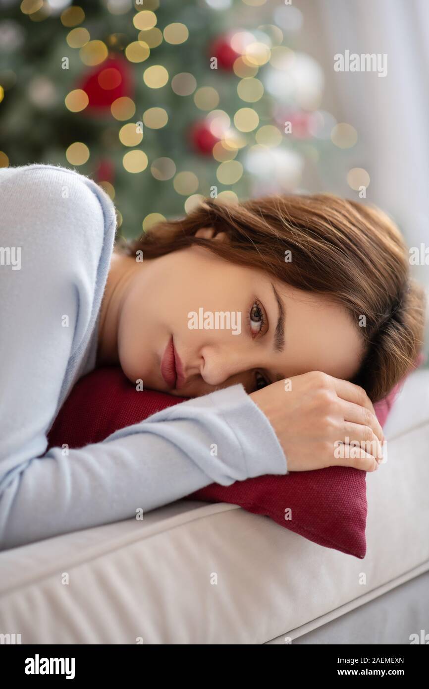 Sofa woman laying sad hi-res stock photography and images - Alamy