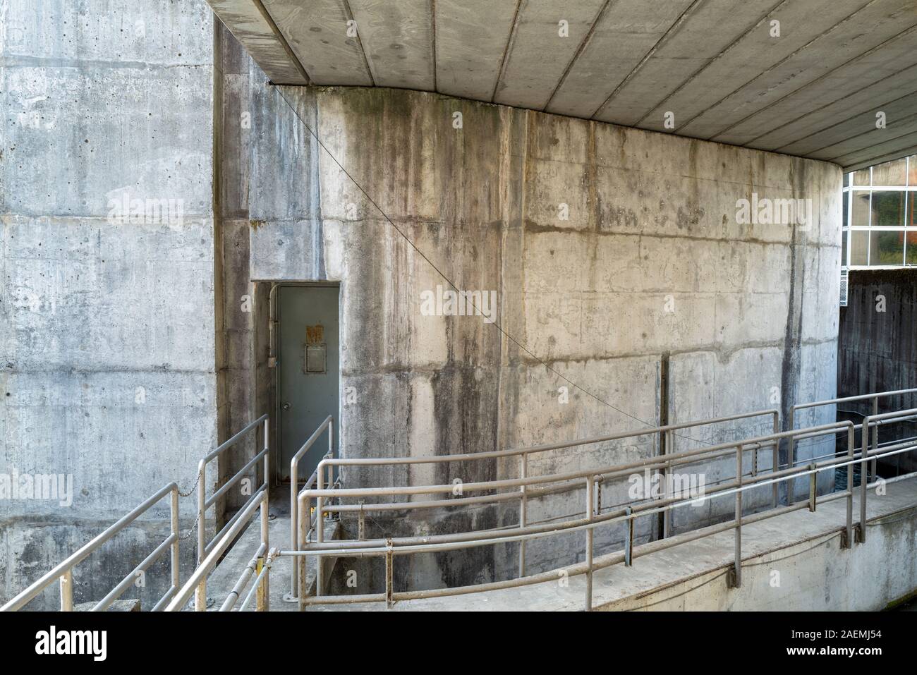 Concrete walkway by a fish ladder at the Bonneville Dam, Washington ...
