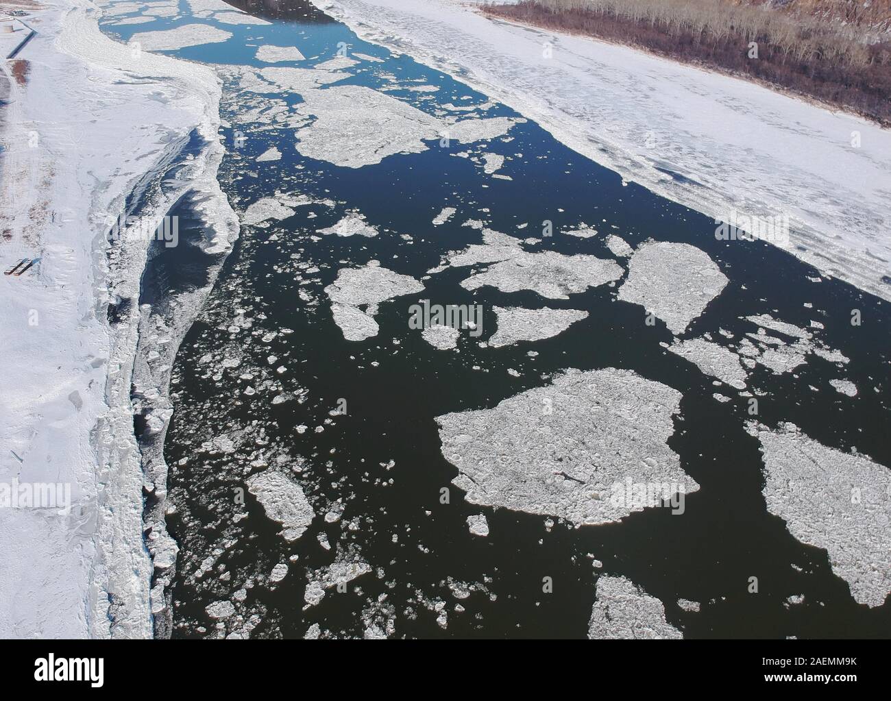 An aerial view of various ice with different shapes and areas floating ...