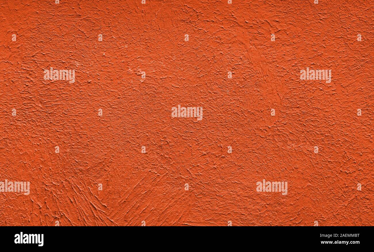 Red abstract texture toned in the trendy color. Decorative plaster ...