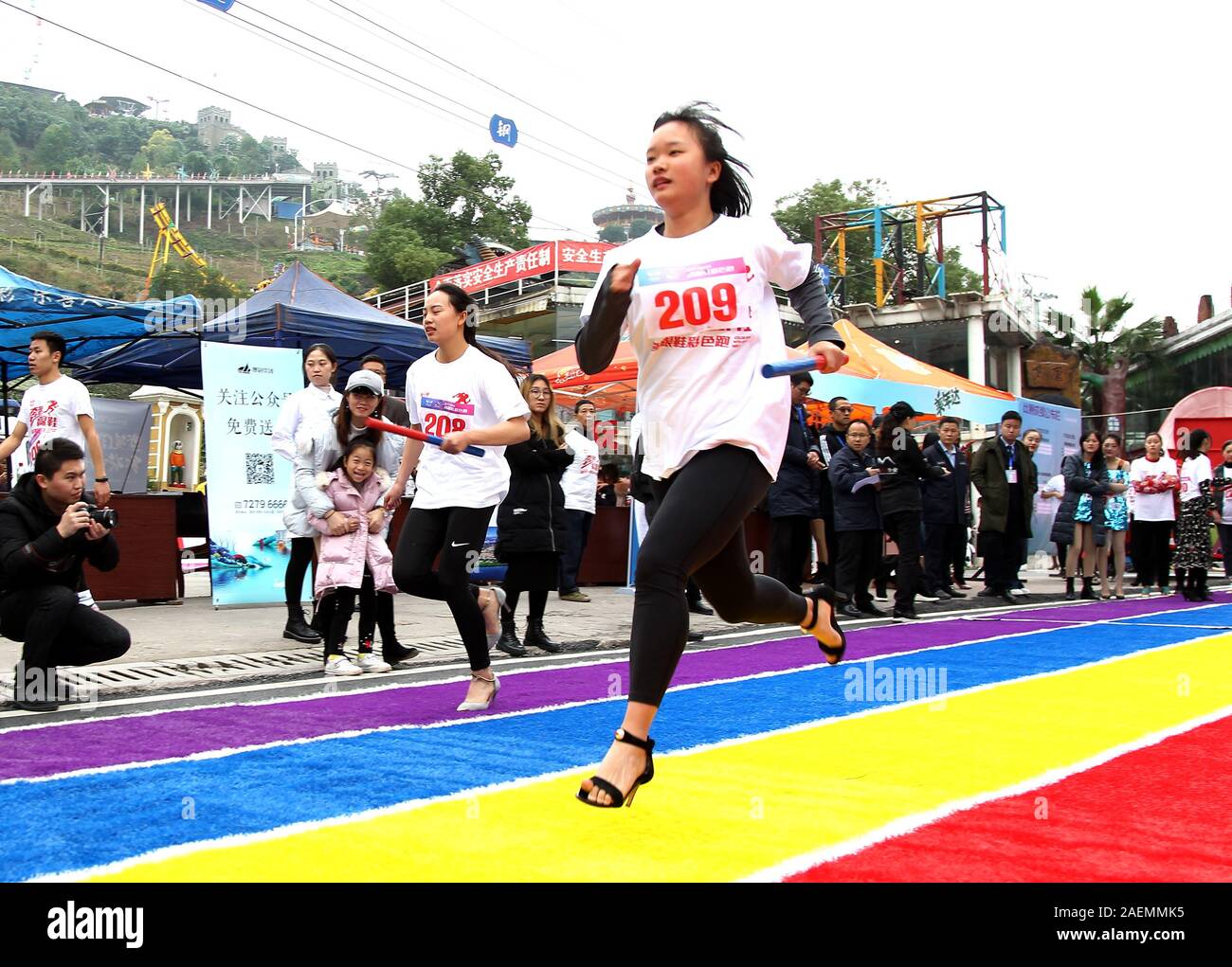 People run with high-heel shoes at the 6th High-Heeled Shoes Color Run ...