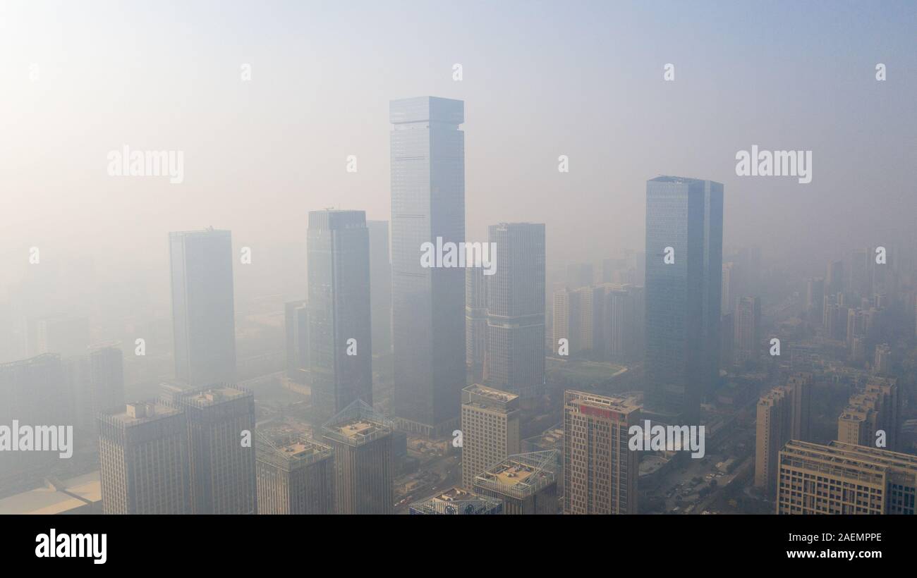Aerial view of the skyscrapers covered by heavy haze in downtown area ...