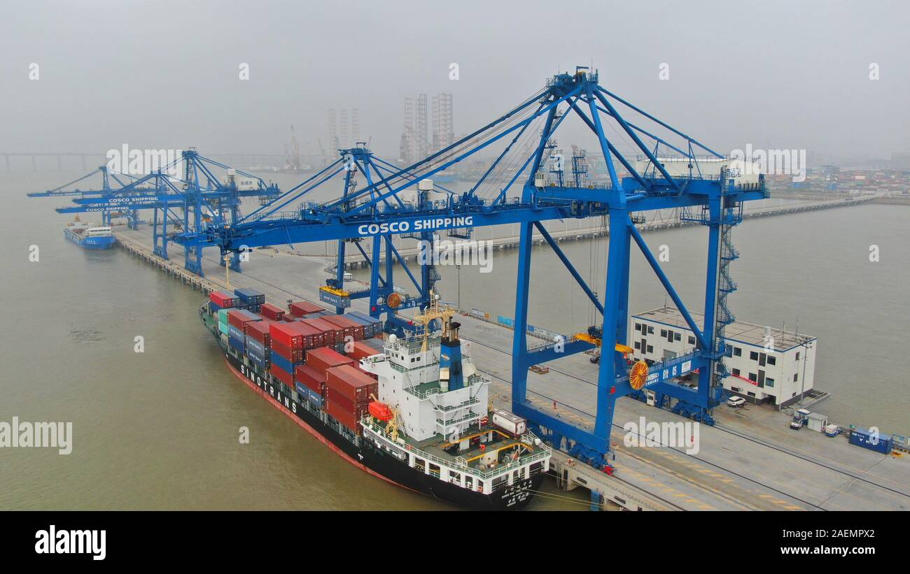 An aerial view of containers being loaded on ships at Port of Nantong ...