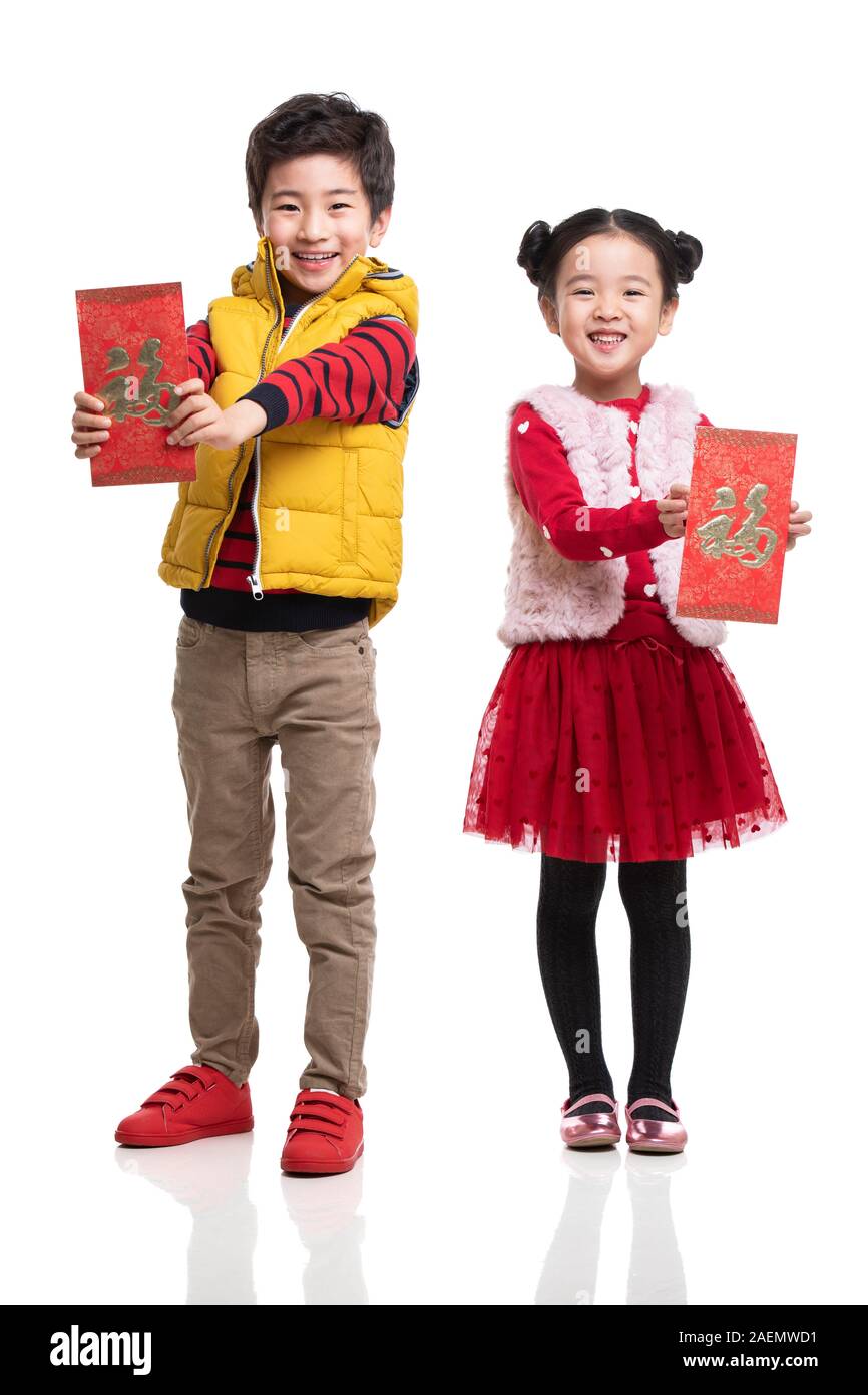 Happy sibling celebrating Chinese New Year Stock Photo - Alamy