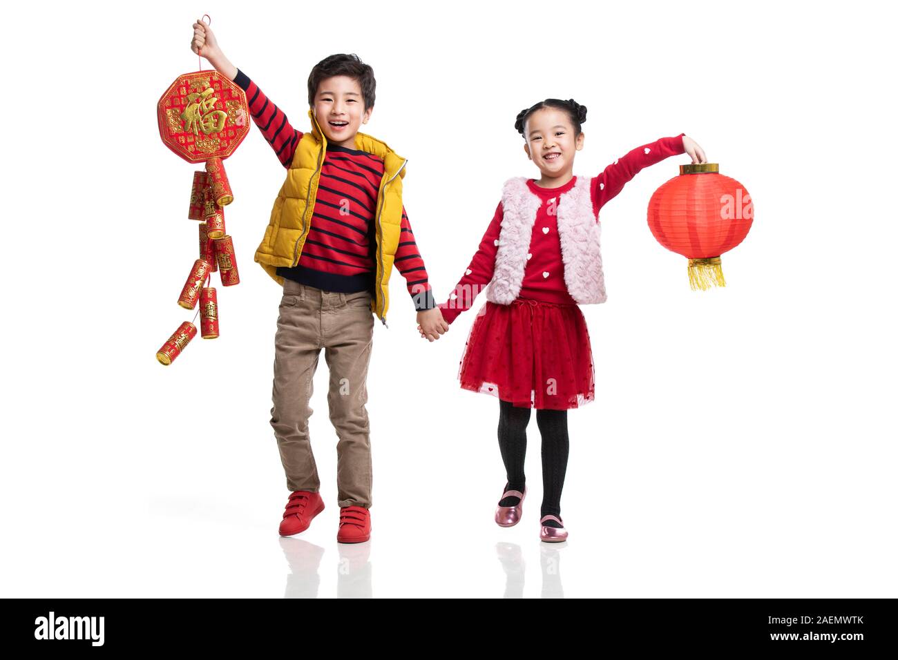 Happy sibling celebrating Chinese New Year Stock Photo - Alamy