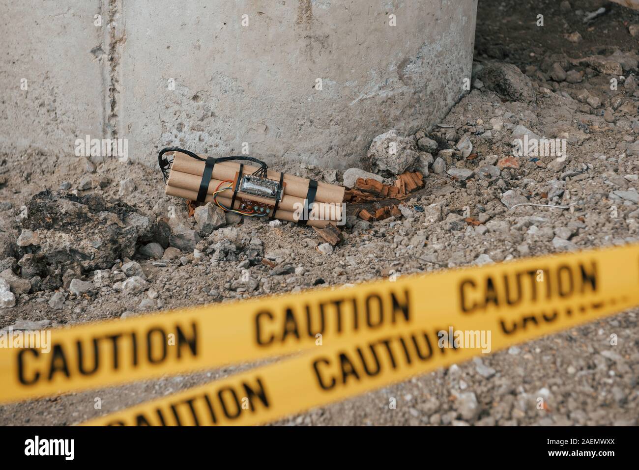 Near bridge support. Dangerous explosive lying on the ground. Yellow ...