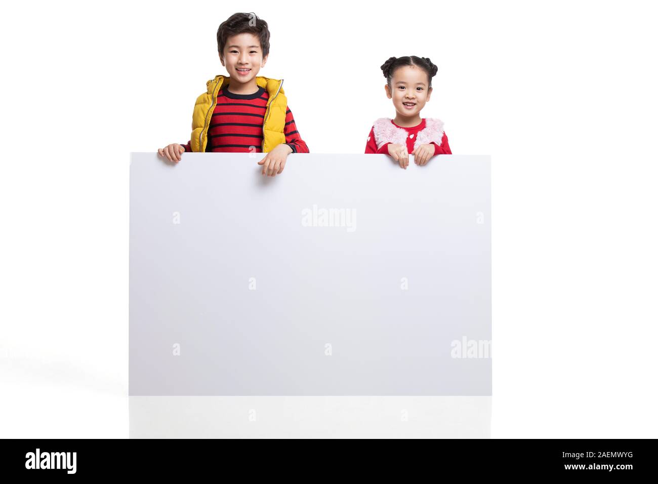 Happy children with whiteboard Stock Photo - Alamy