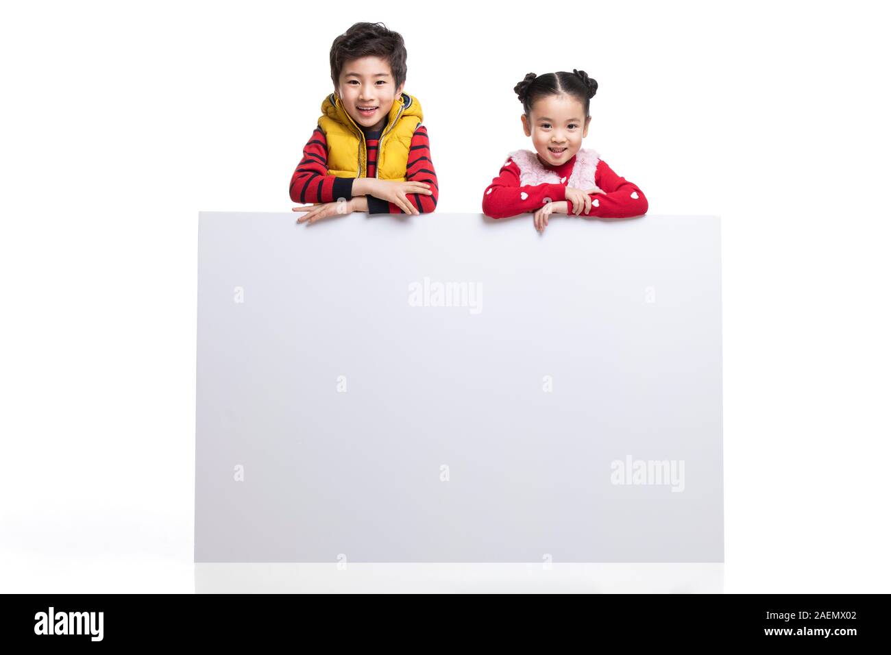 Happy children with whiteboard Stock Photo - Alamy