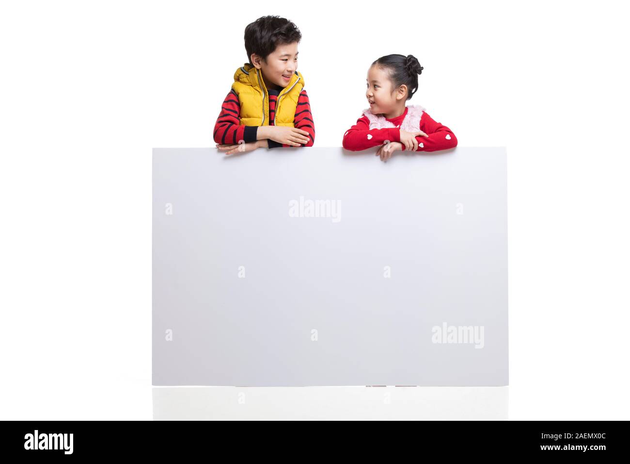 Happy children with whiteboard Stock Photo - Alamy