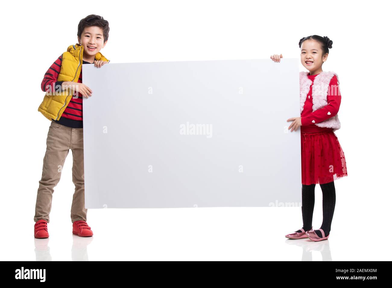 Happy children with whiteboard Stock Photo - Alamy