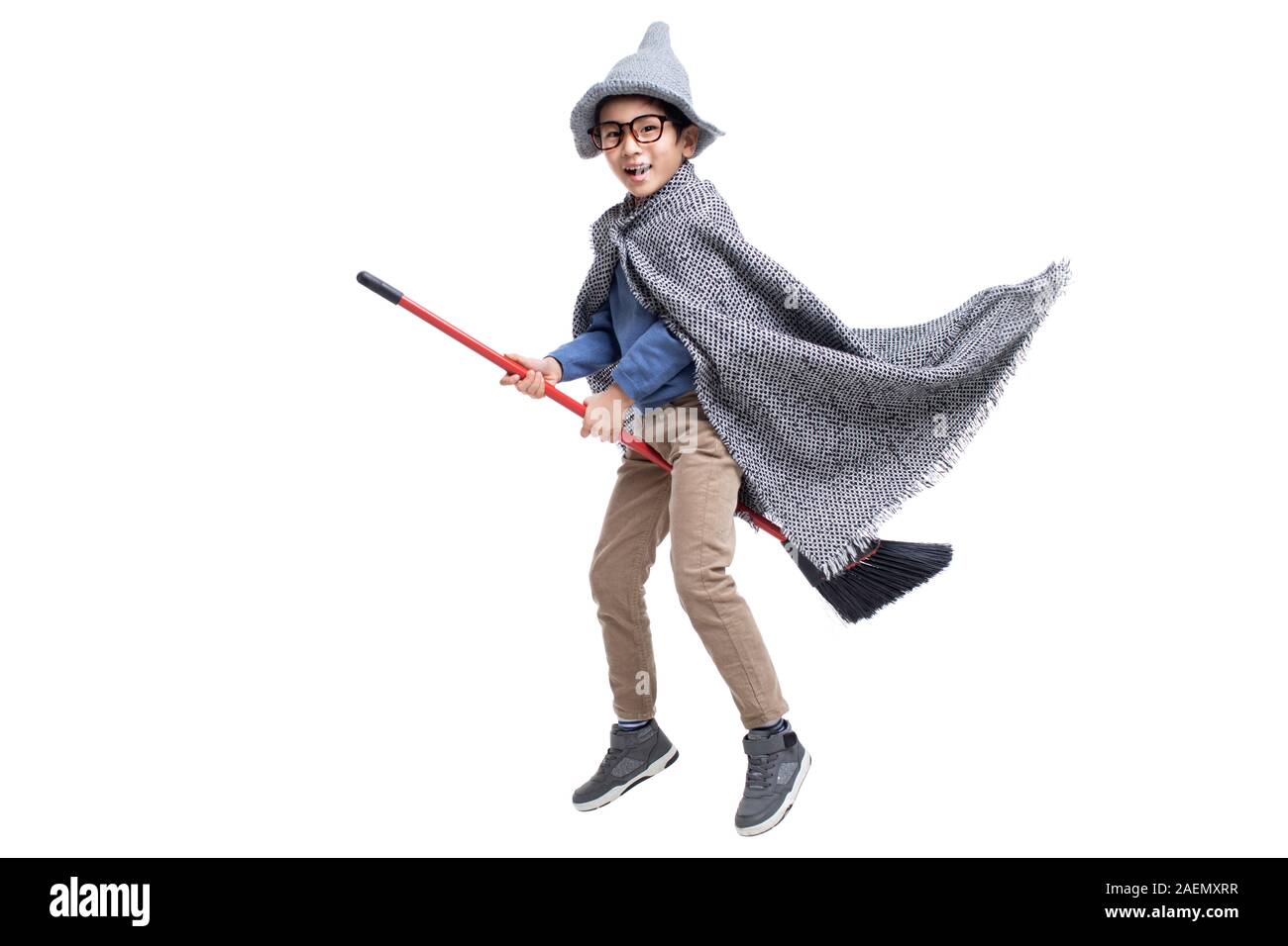 Happy little boy in wizard costume Stock Photo - Alamy