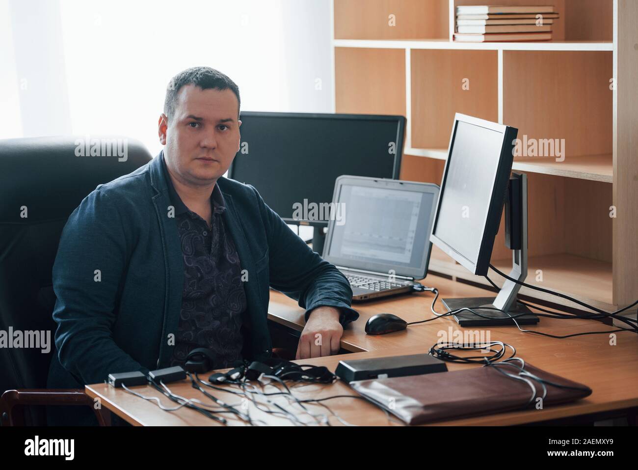One person only. Polygraph examiner works in the office with his lie ...