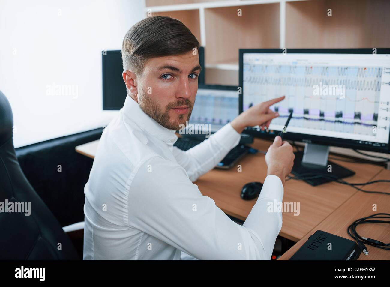 Take a look at that moment. Polygraph examiner works in the office with ...