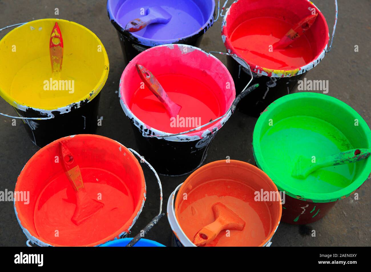 Paint buckets with brushes Stock Photo - Alamy