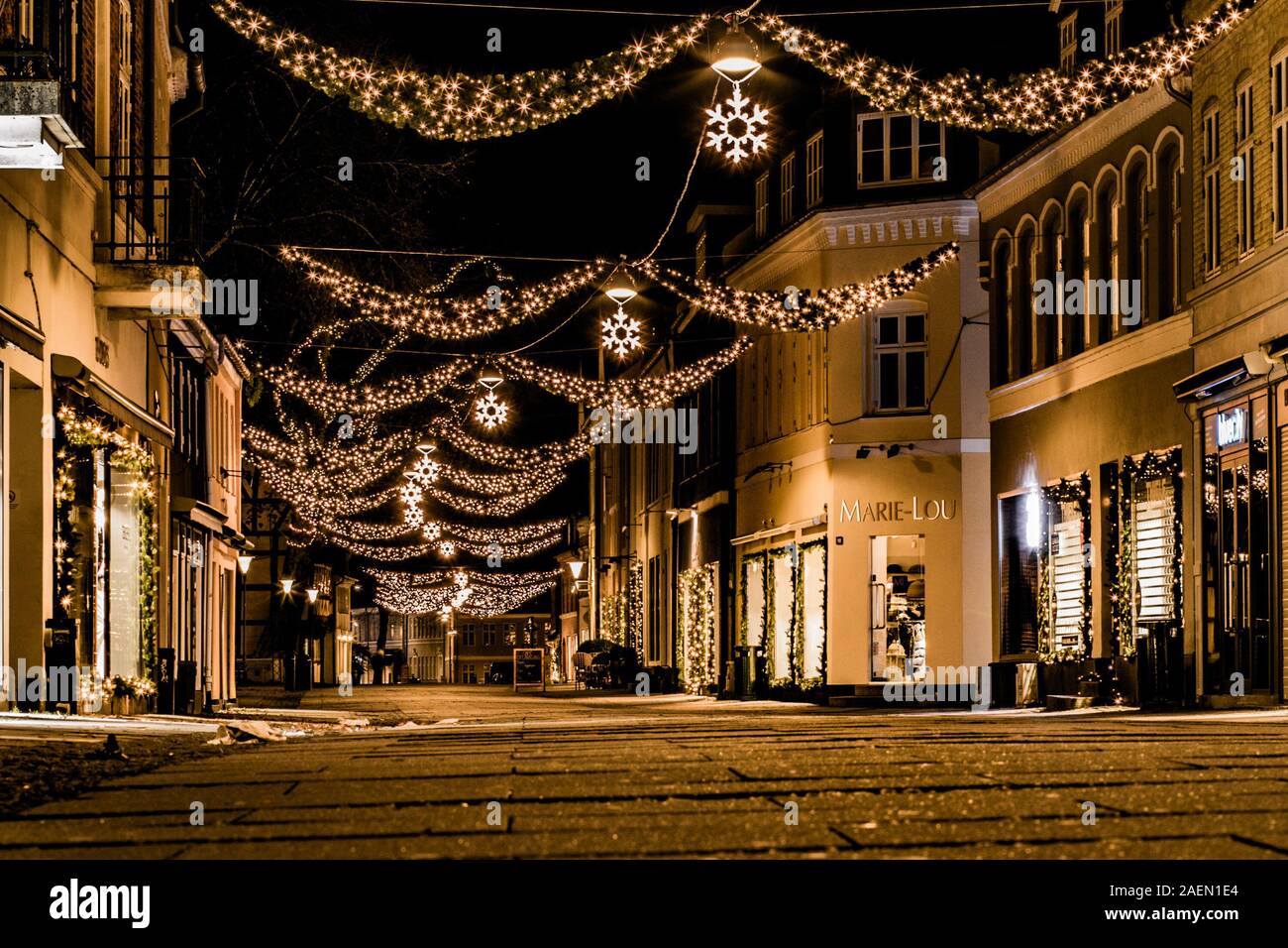 Christmas lights in small street Stock Photo - Alamy