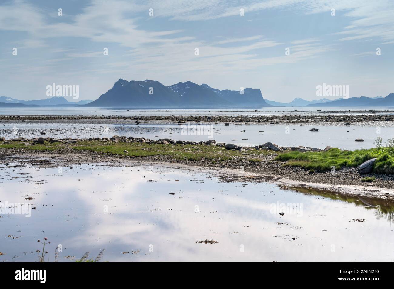 landscape with islands and clouds reflecting in swamp on fjord shore ...