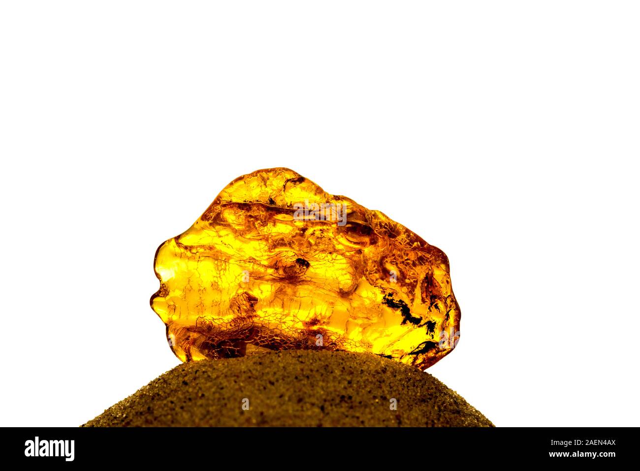 Amber in sun with inclusions on a white empty background Stock Photo ...