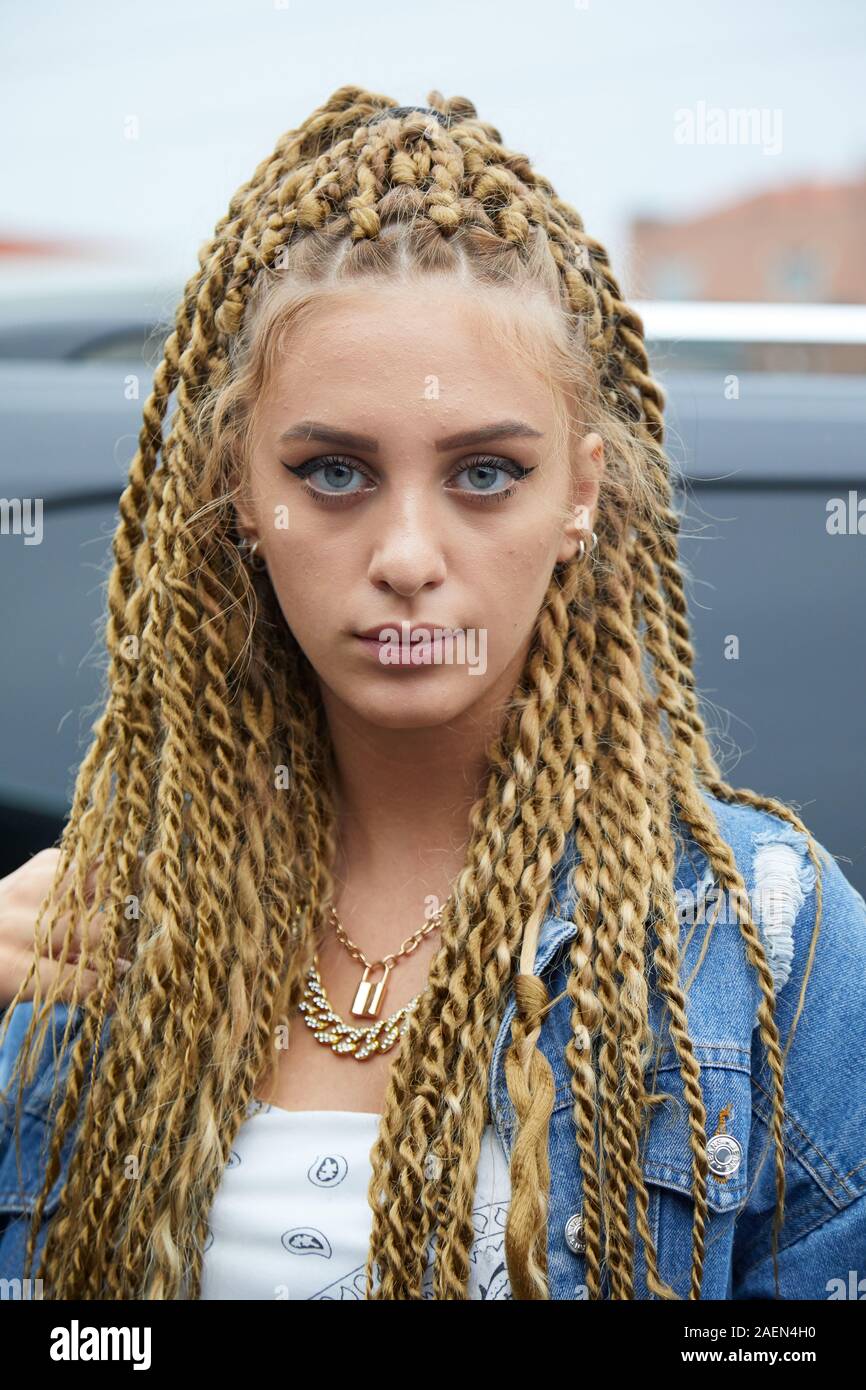 MILAN, ITALY - SEPTEMBER 22, 2019: Woman with long, blond braids before ...