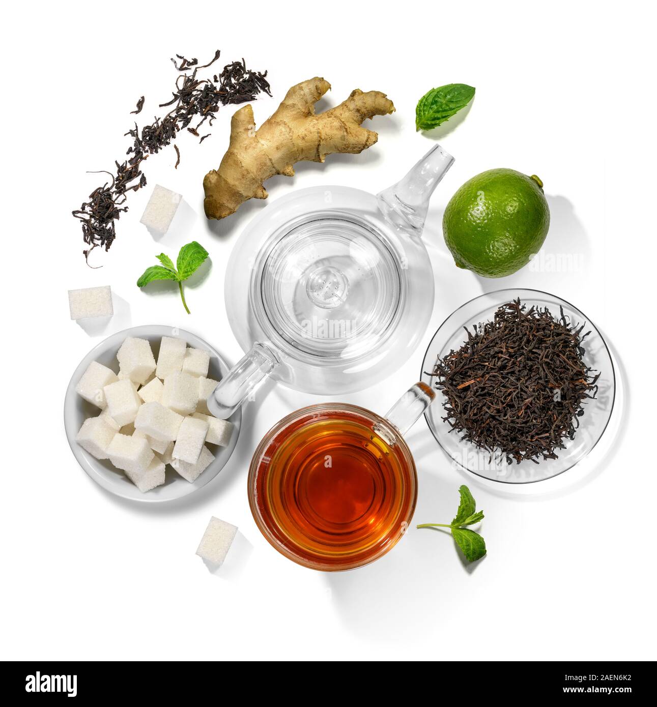 Black tea and accessories top view on white background Stock Photo - Alamy