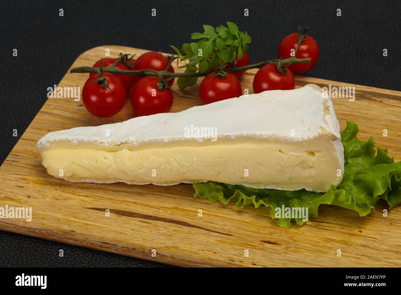 Brie cheese triangle served salad leaves Stock Photo - Alamy