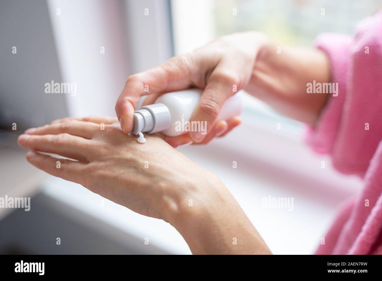 Lady putting on cream hi-res stock photography and images - Alamy