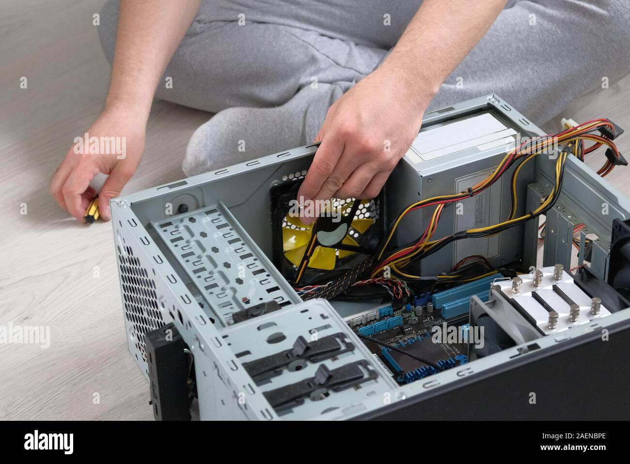 Computer repair. Hands of technician repairing a computer, close up ...