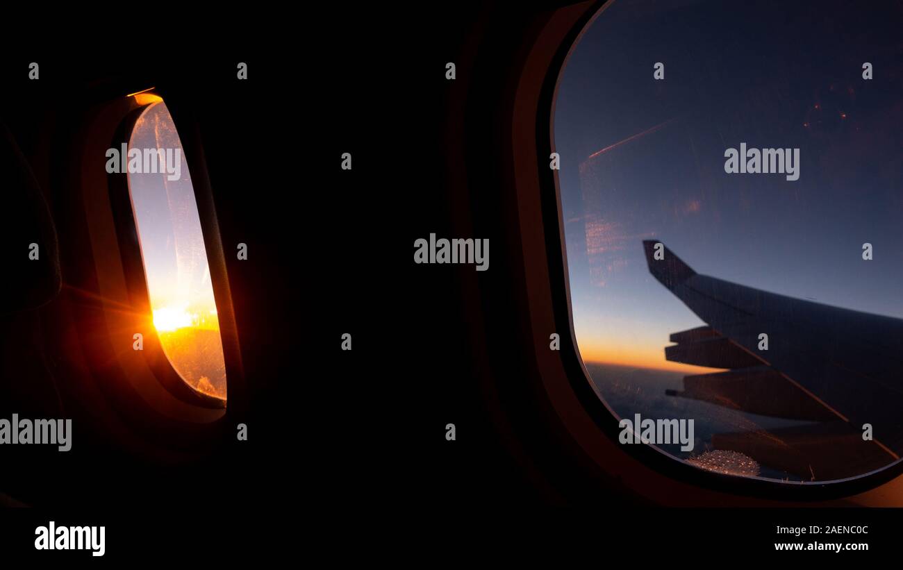 Jet windows from inside the passenger seat Stock Photo - Alamy