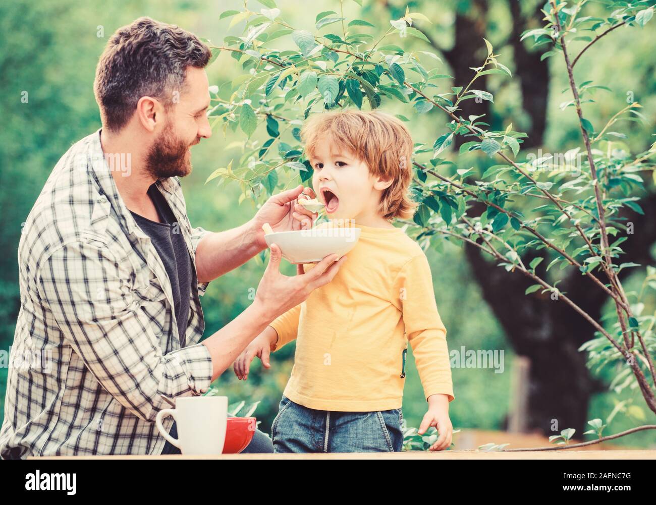 Nutrition habits. Little boy and dad eating. Nutrition for kids and ...
