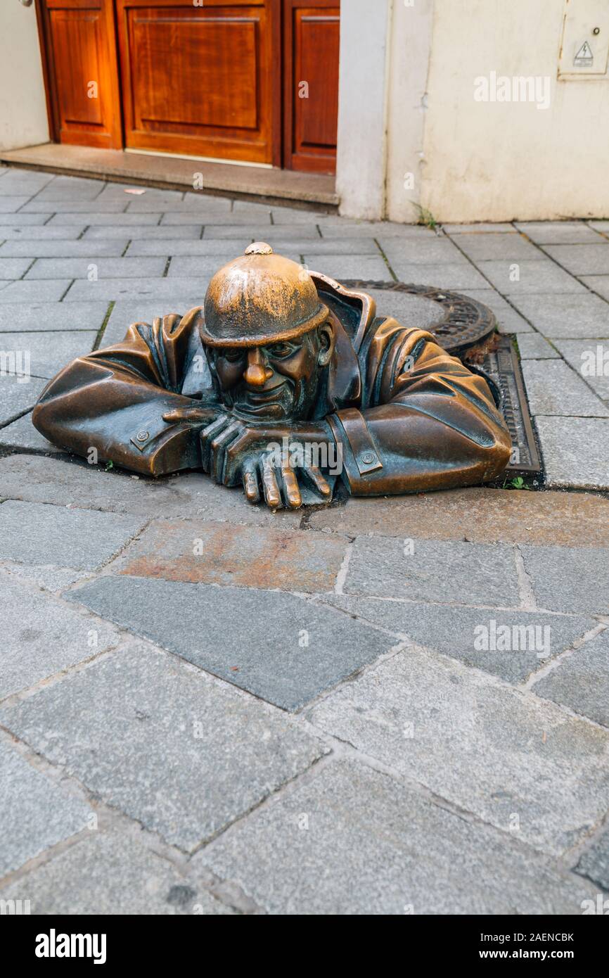 Bratislava, Slovakia - June 24, 2019 : Cumil man at work statue at old ...