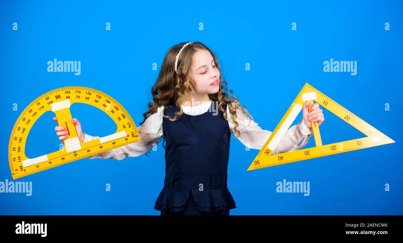 Pupil girl with big rulers. School student learning geometry. small ...