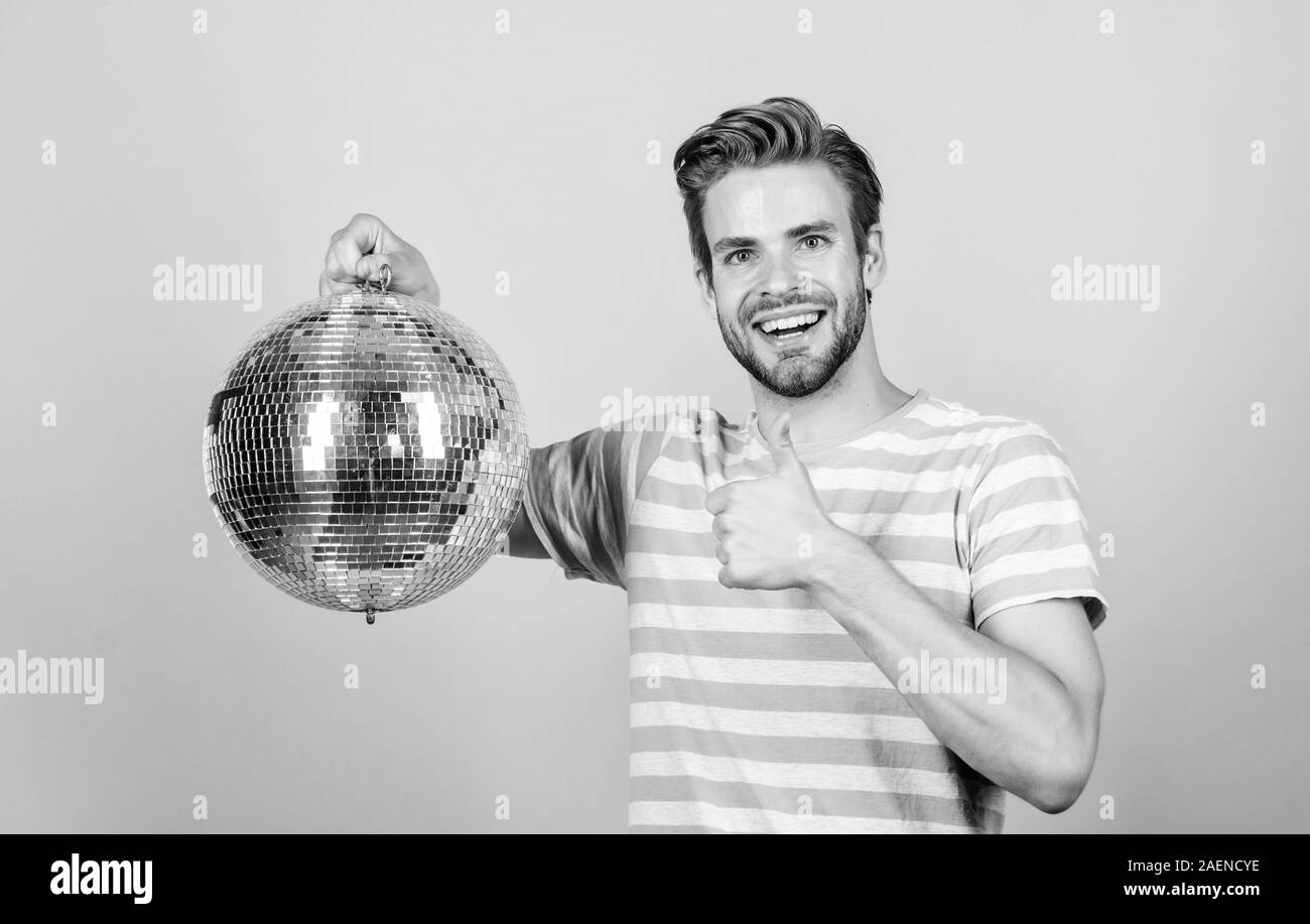 Cheerful dj man. How about party. Handsome man hold disco ball. Disco ...