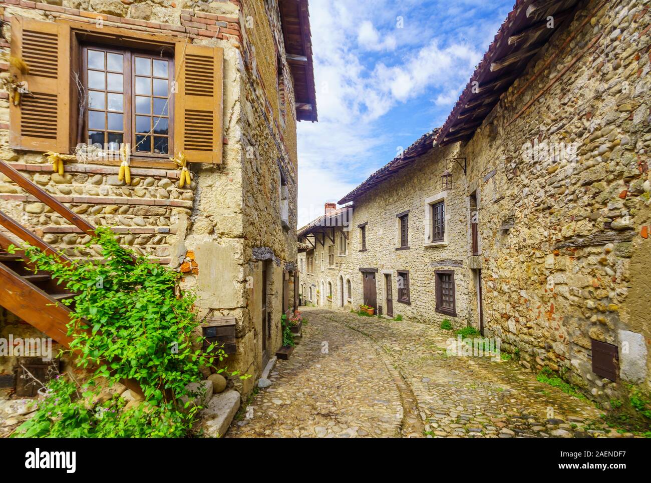 View of an alley in the medieval village Perouges, Ain department ...