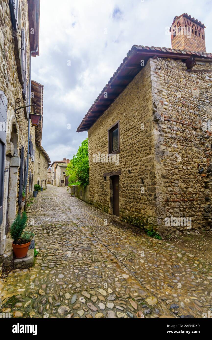 View of an alley in the medieval village Perouges, Ain department ...