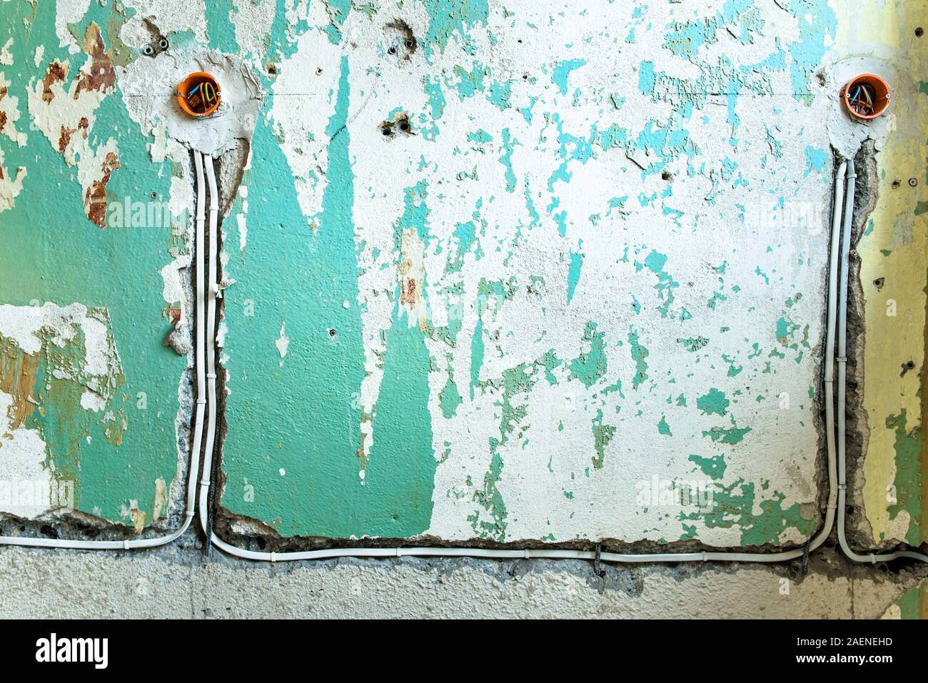 New electrical installation, socket and electrical wires on the wall ...