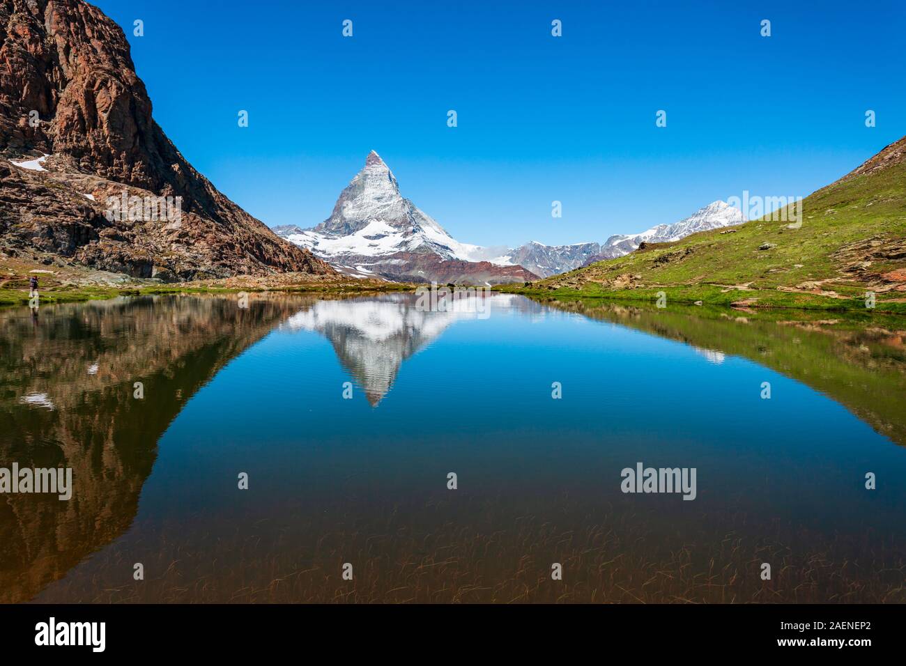 Riffelsee lake and Matterhorn mountain in the Alps, located between ...
