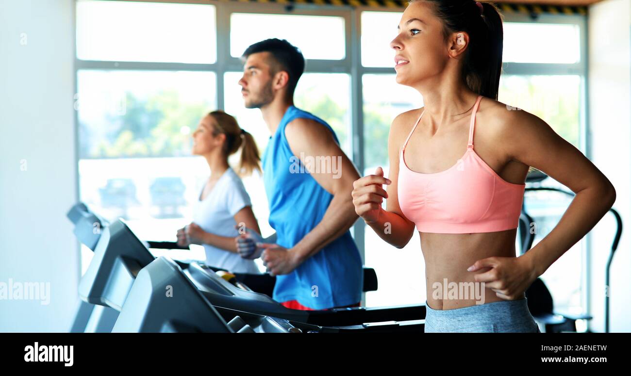 Picture of people running on treadmill in gym Stock Photo - Alamy